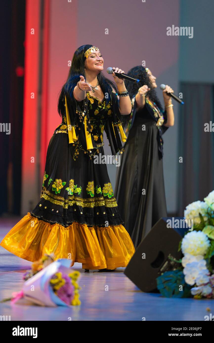 A team of musicians, singers and dancers in gypsy costumes singing and ...
