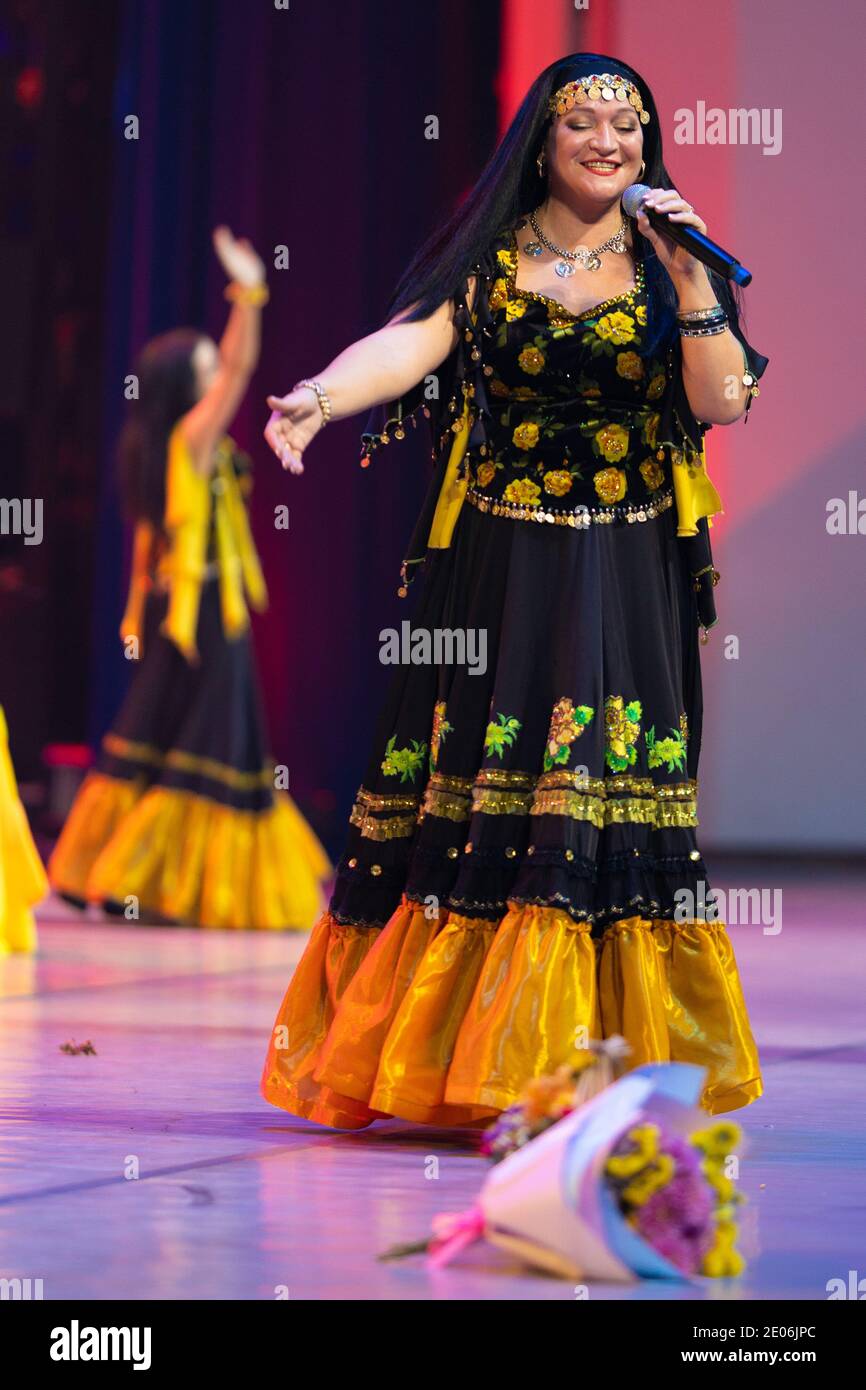 A team of musicians, singers and dancers in gypsy costumes singing and ...