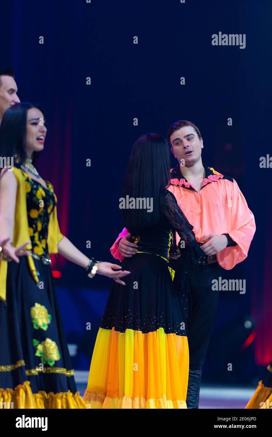 A team of musicians, singers and dancers in gypsy costumes singing and ...