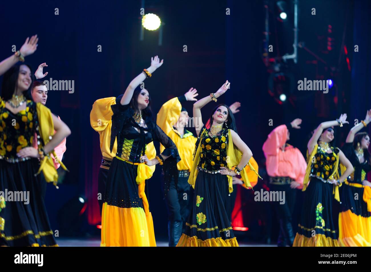 A team of musicians, singers and dancers in gypsy costumes singing and ...