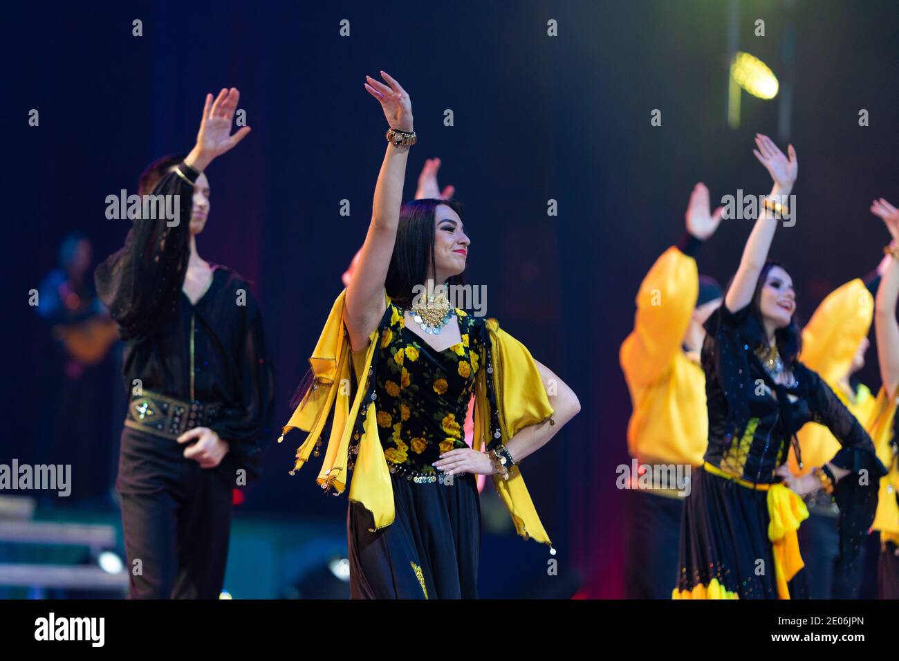 A team of musicians, singers and dancers in gypsy costumes singing and ...