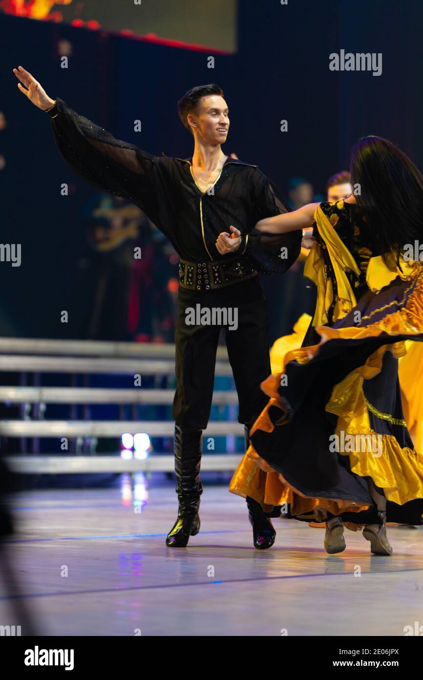 A team of musicians, singers and dancers in gypsy costumes singing and ...