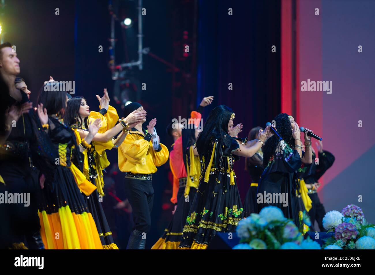 A team of musicians, singers and dancers in gypsy costumes singing and ...