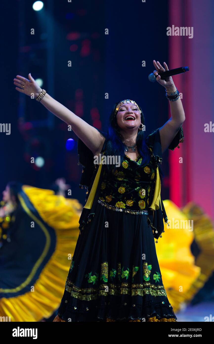 A team of musicians, singers and dancers in gypsy costumes singing and ...
