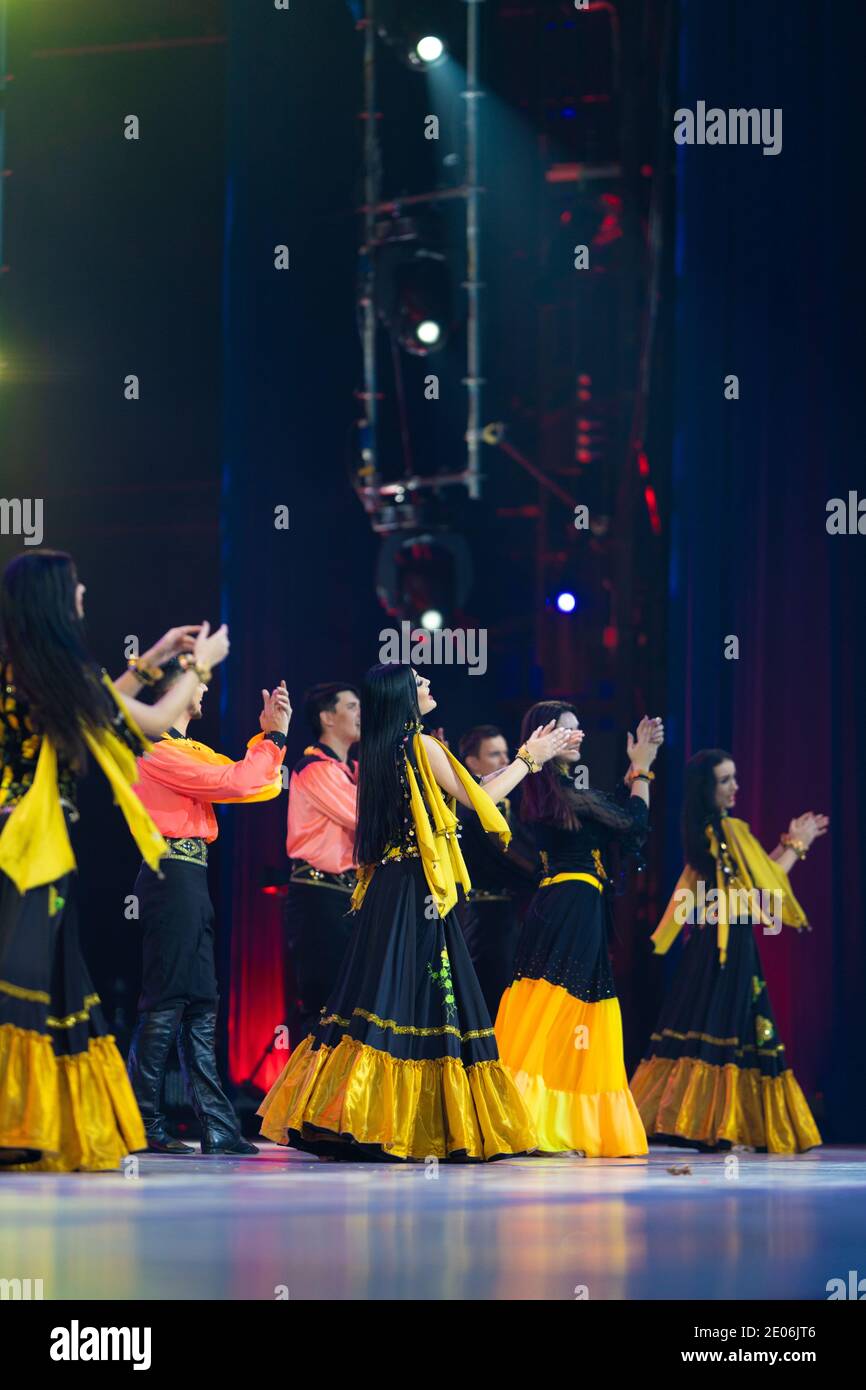 A team of musicians, singers and dancers in gypsy costumes singing and ...