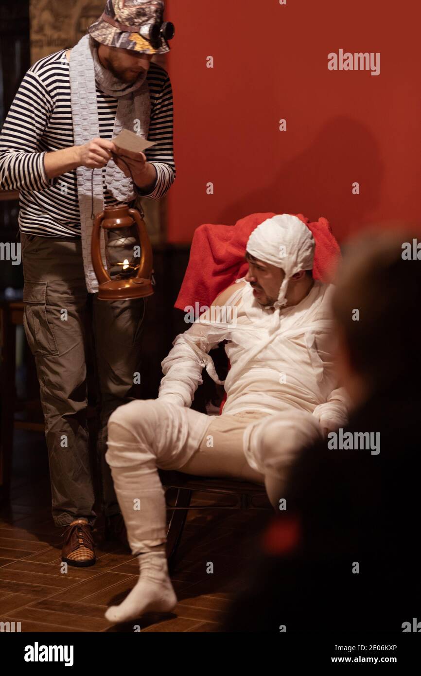 Actors and actresses play a modern interactive performance show in a ...