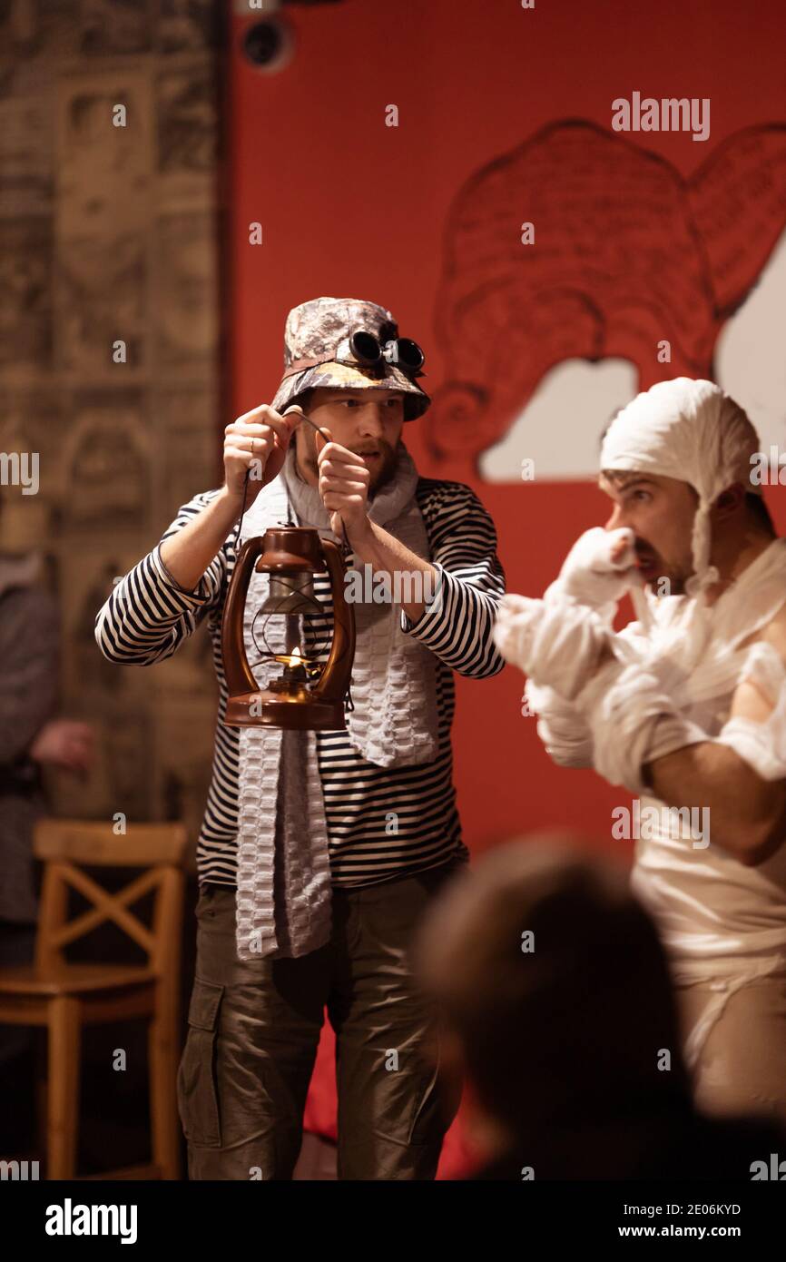 Actors and actresses play a modern interactive performance show in a ...
