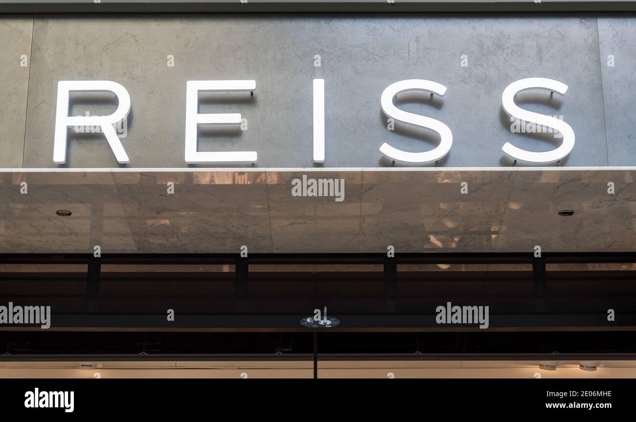 Reiss sign at store entrance. Reiss is a modern, global fashion brand ...