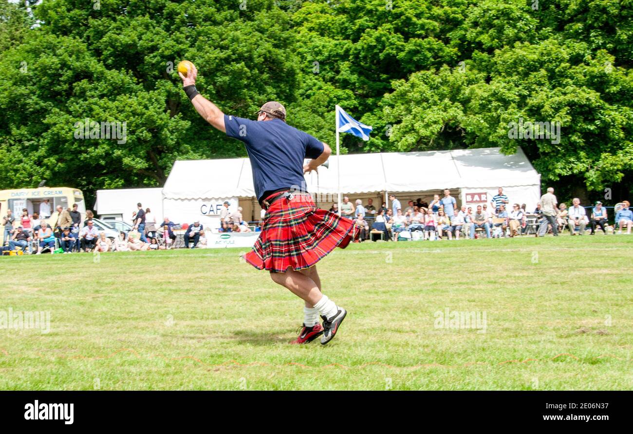 A competitor competing in throwing the Shot Put contest during the 2008 ...