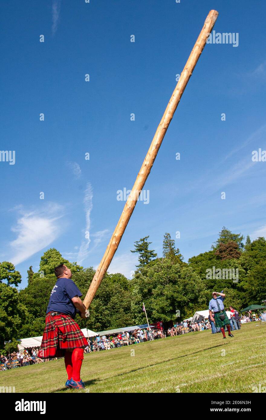 A competitor competing in the Tossing of the Caber contest during the ...