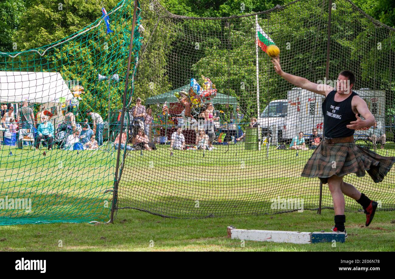 A competitor competing in throwing the Shot Put contest during the 2008 ...