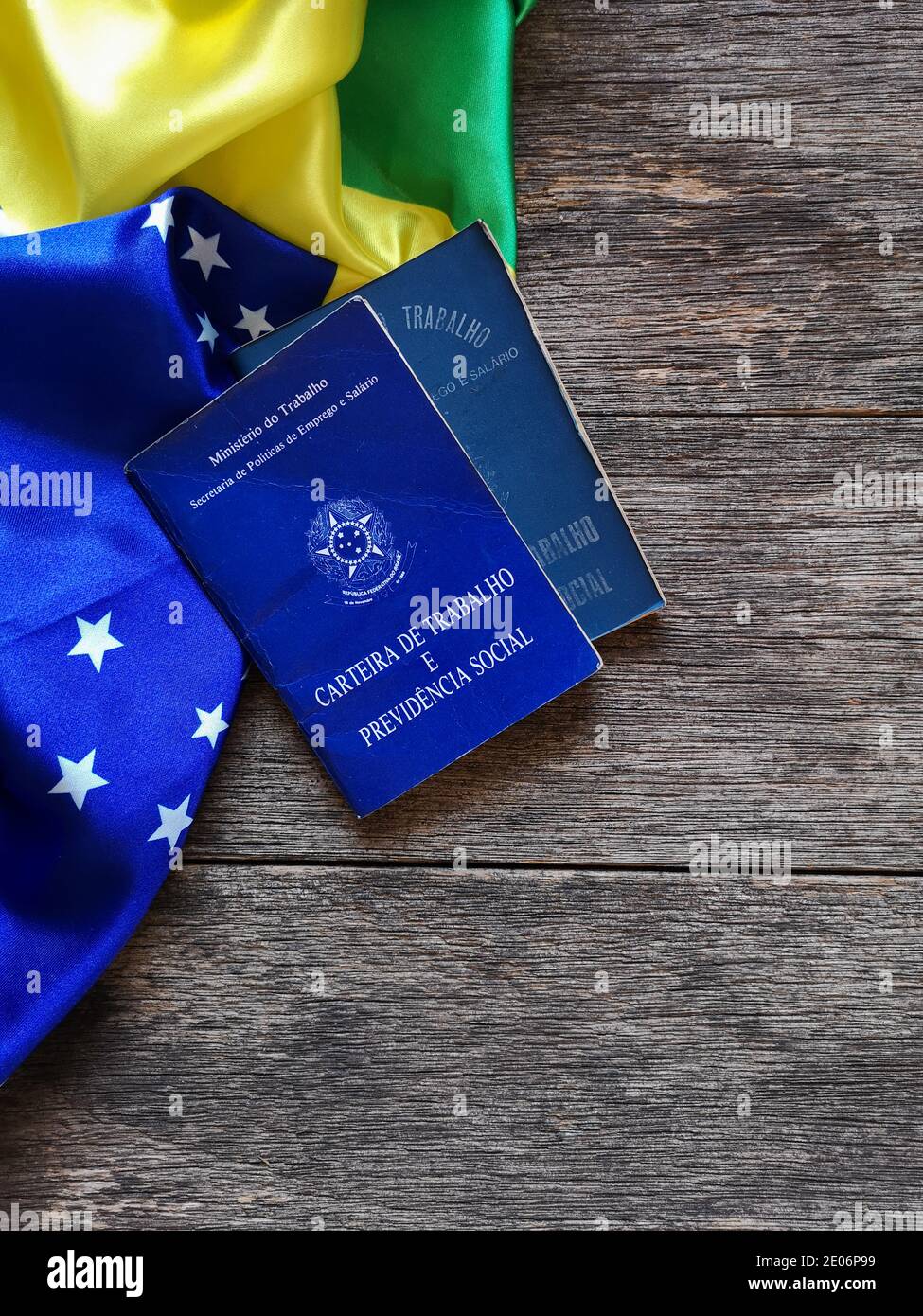 Brazilian work card on wooden table with Brazilian flag Stock Photo - Alamy