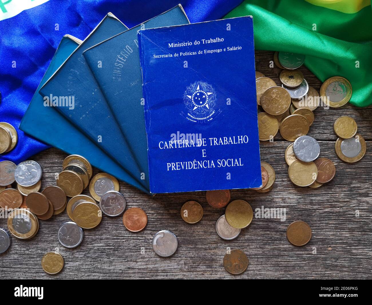 Brazilian work card on wooden table with Brazilian flag and coins Stock ...