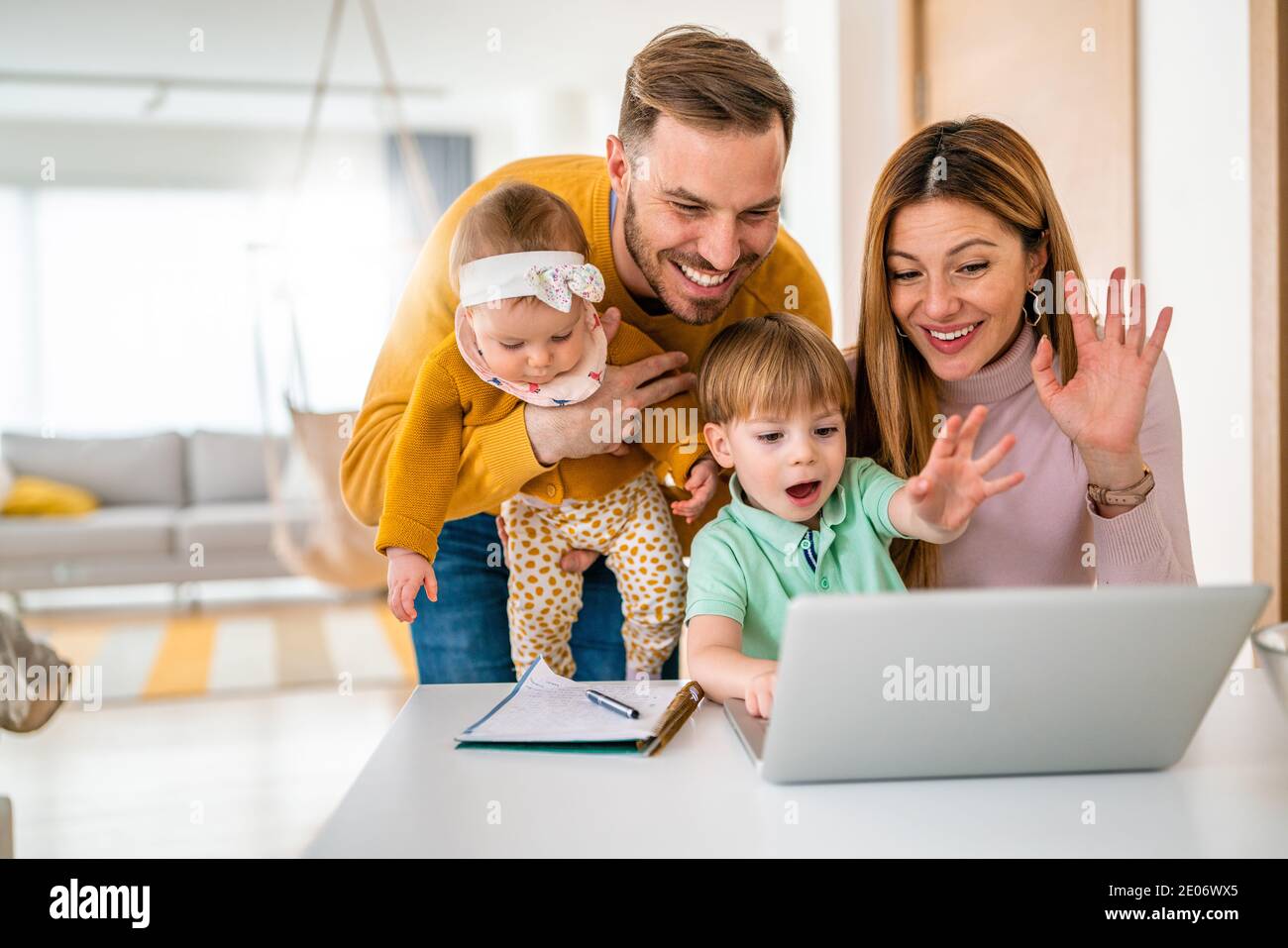 Happy smiling family chatting with computer together at home Stock ...