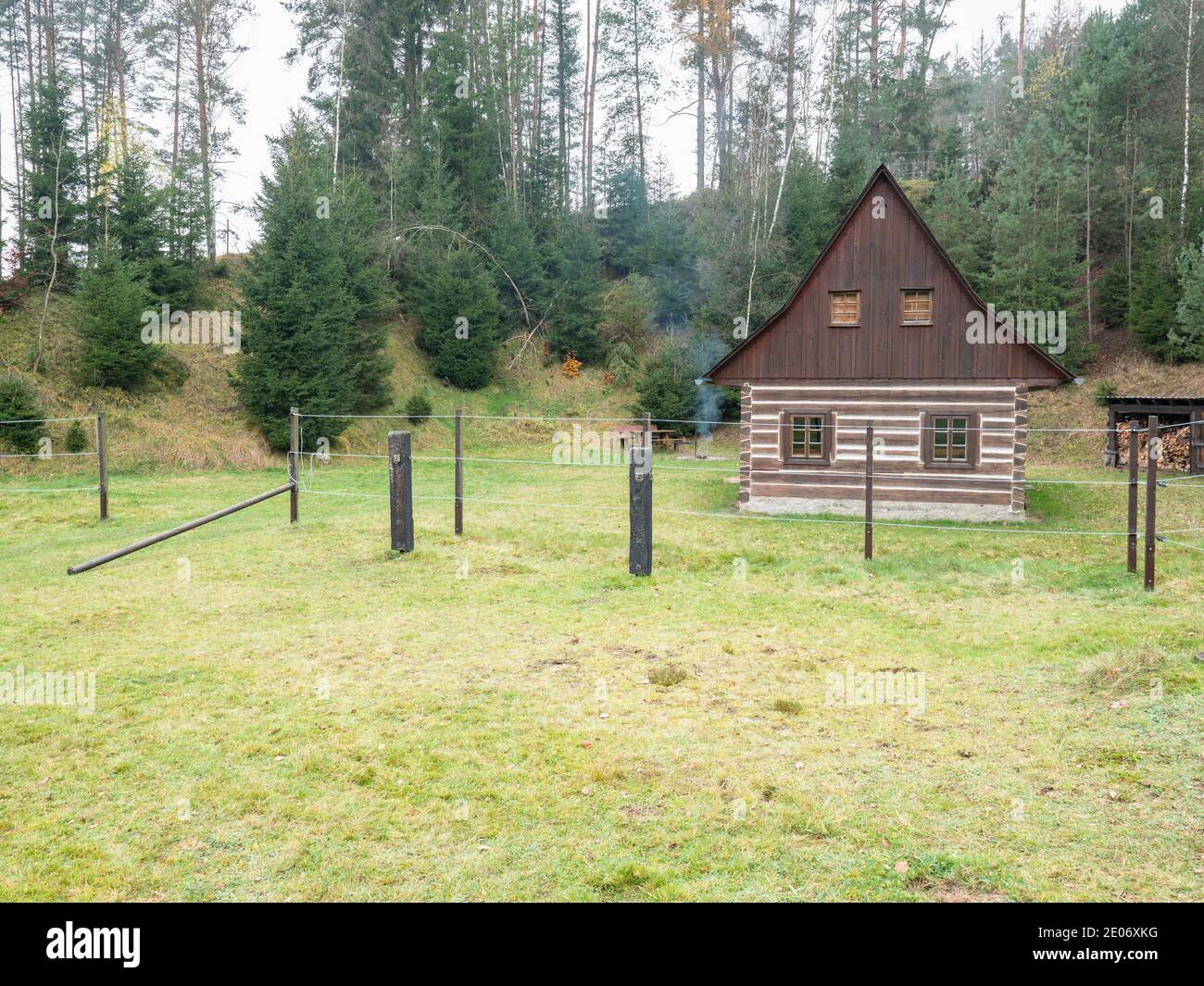 Traditional wooden cottage in valley at forest. Czech republic Stock ...