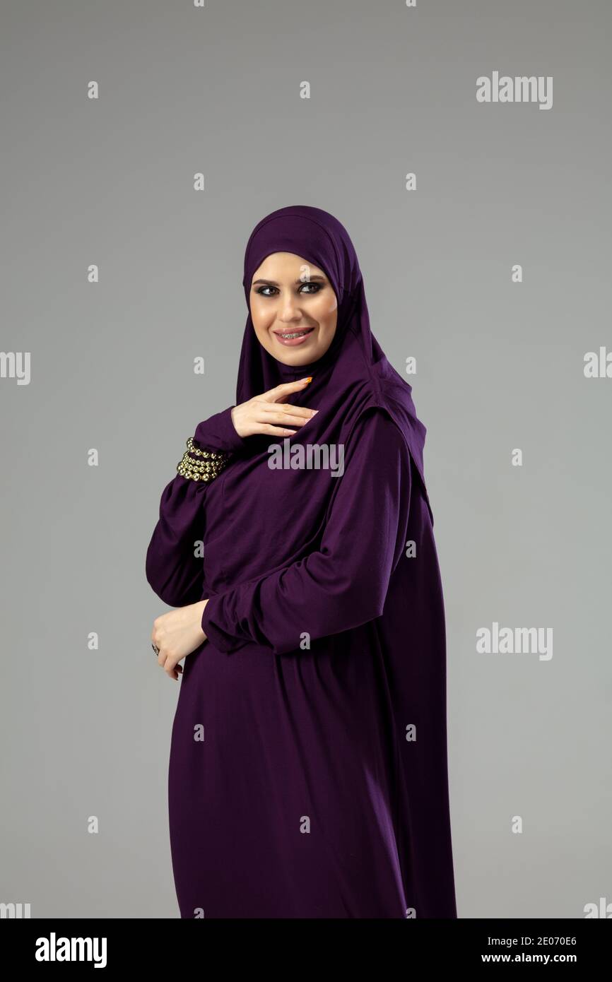 Cheerful. Beautiful arab woman posing in stylish hijab isolated on ...