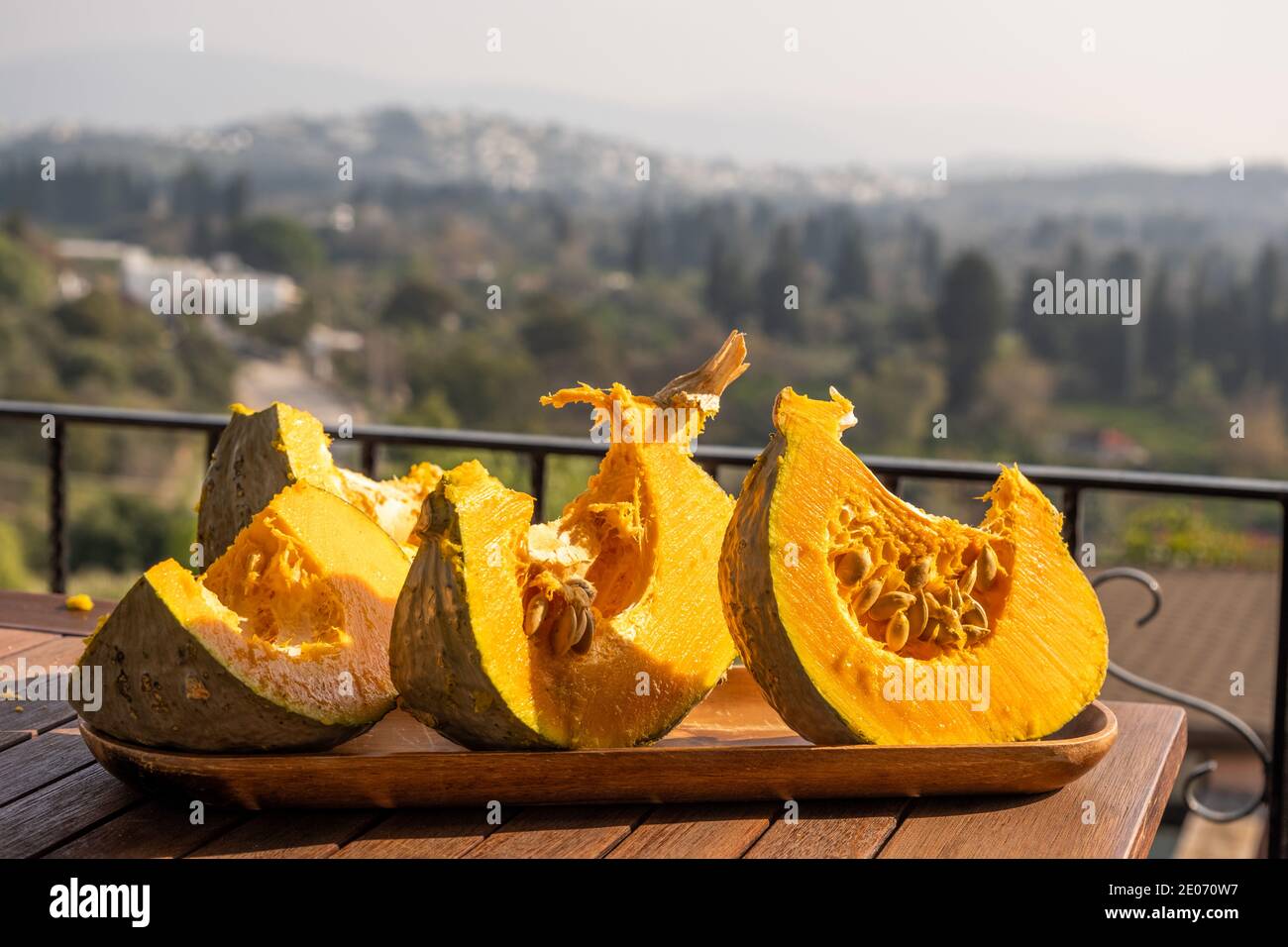 Side view of four slices of a freshly cut pumpkin. Raw vegetable inner ...