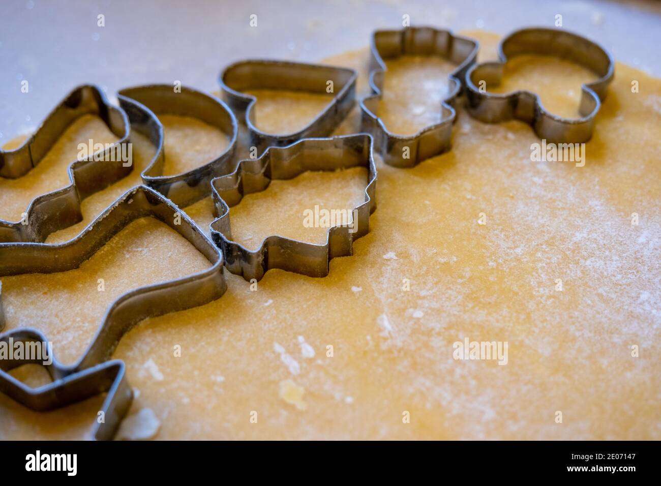 Christmas cookie baking concept: Close up of decorative cookie cutters ...