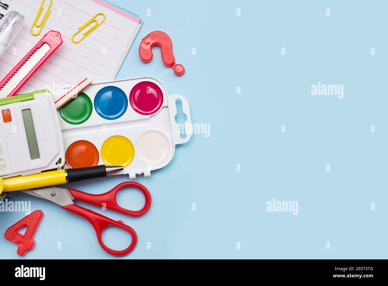 Colorful school stationery on blue background with a copy space Stock ...