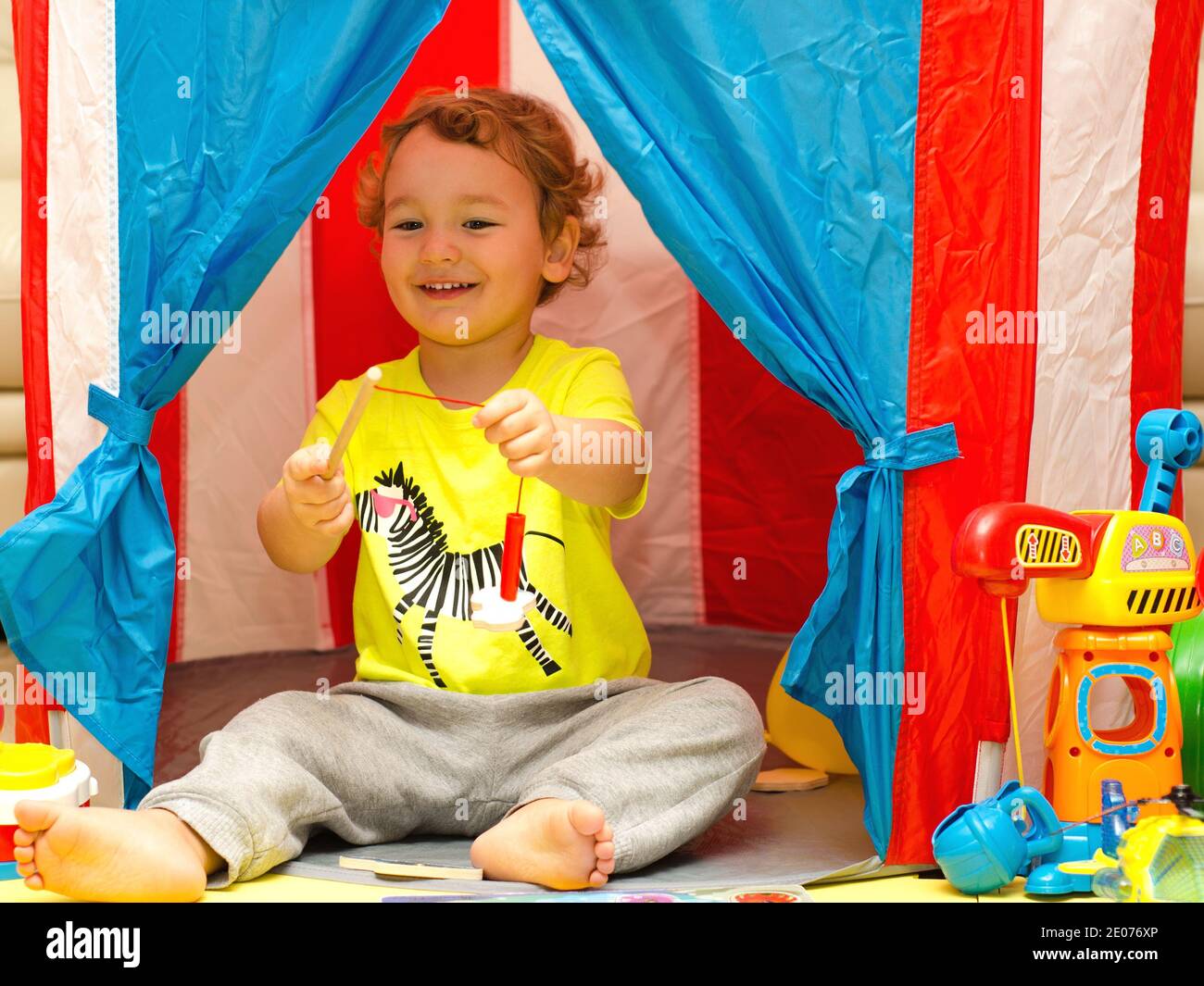 little boy playing with home circus indoors Stock Photo - Alamy