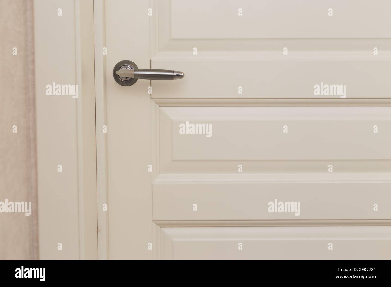 Classic white wooden milled door with chrome handle. White Scandinavian ...