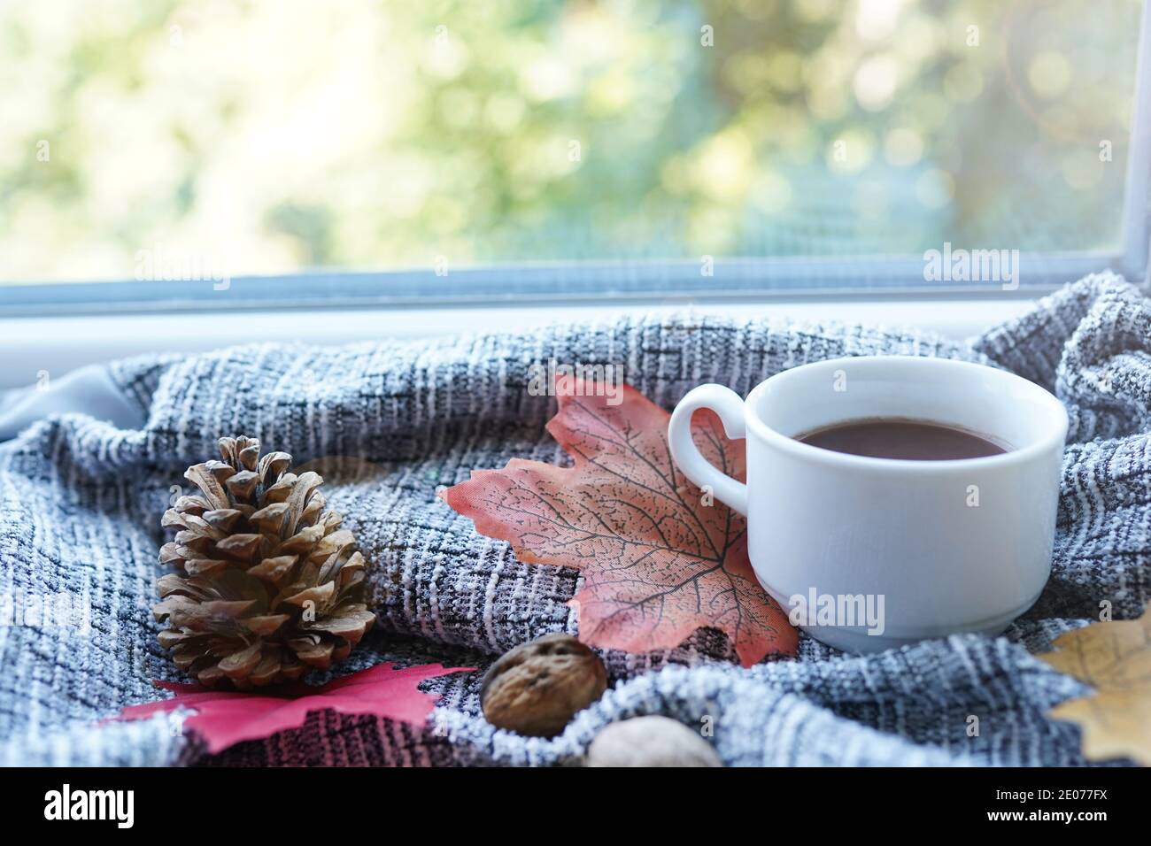 cup of hot coffee and autumn leaves on window Stock Photo - Alamy