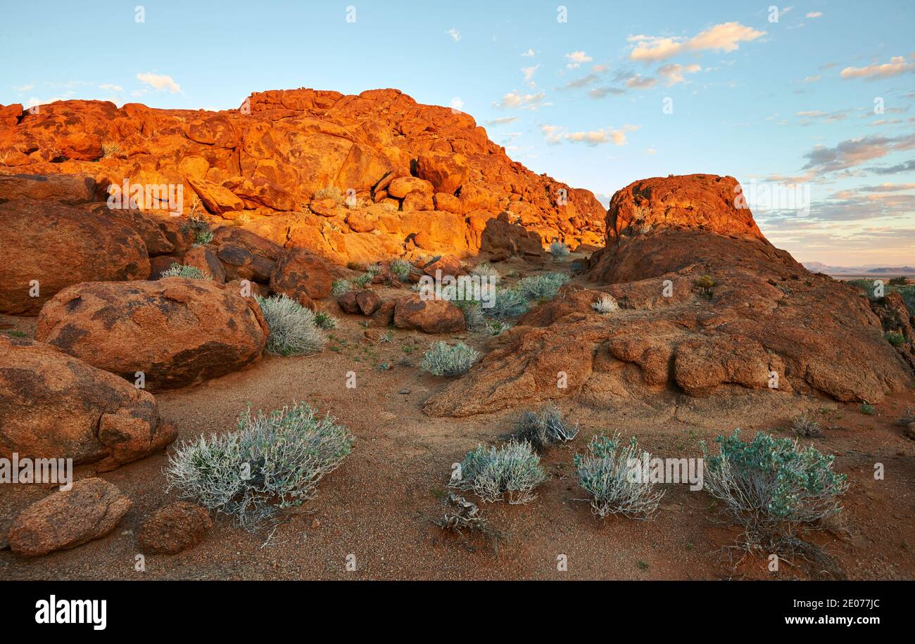 Namibian sunset landscape with big red rocks Stock Photo - Alamy