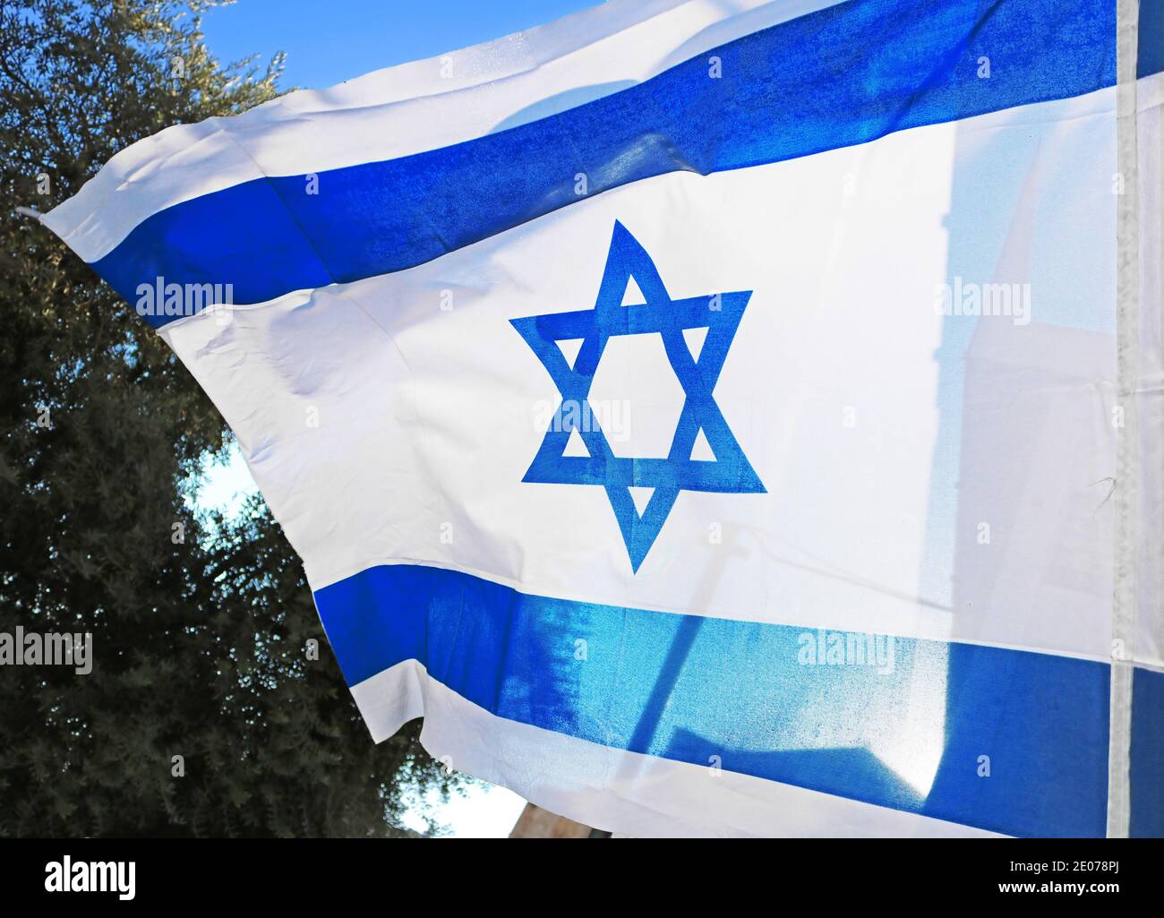 Israel flag. White and blue colors. Israel flag waving against sky ...