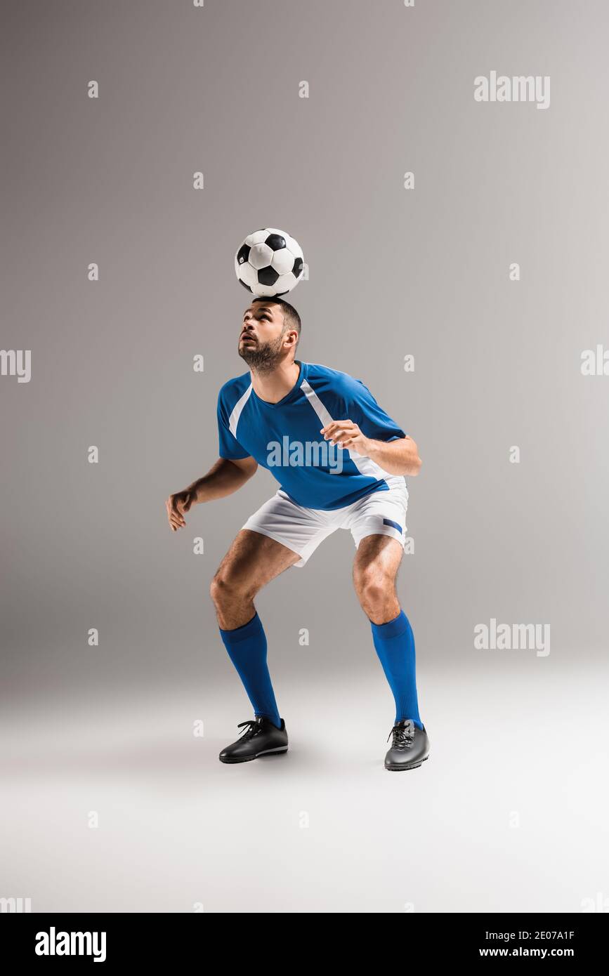 Bearded sportsman balancing football hi-res stock photography and ...