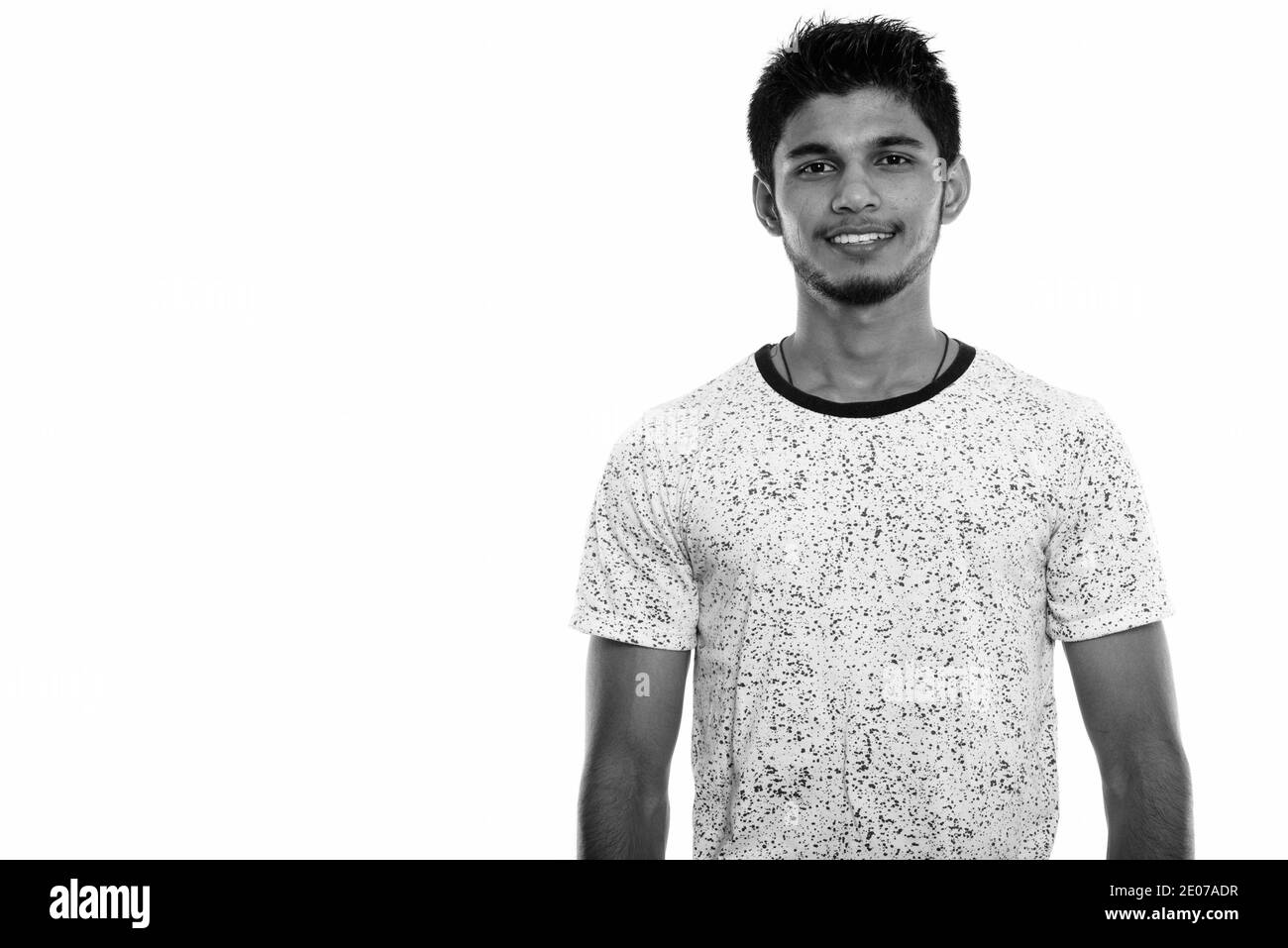 Studio shot of young happy Indian man smiling Stock Photo - Alamy