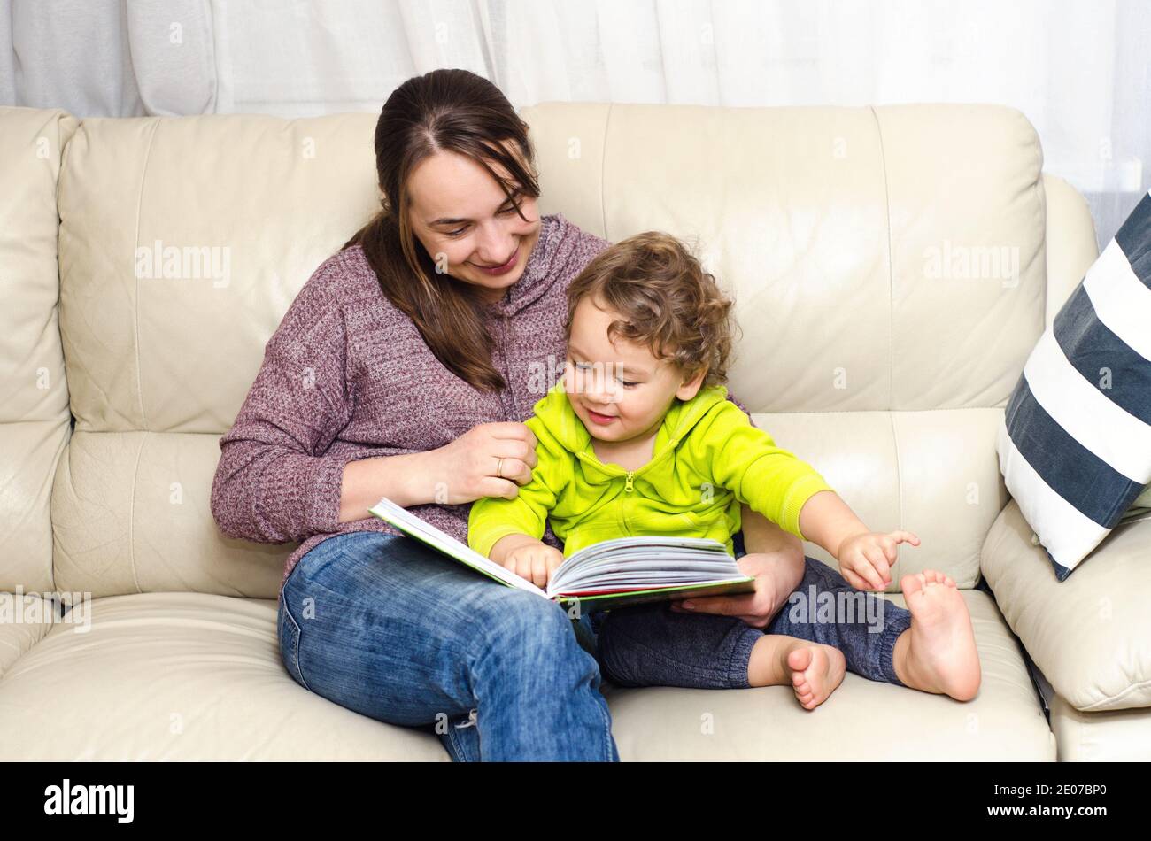 mother and child reading book at home Stock Photo - Alamy