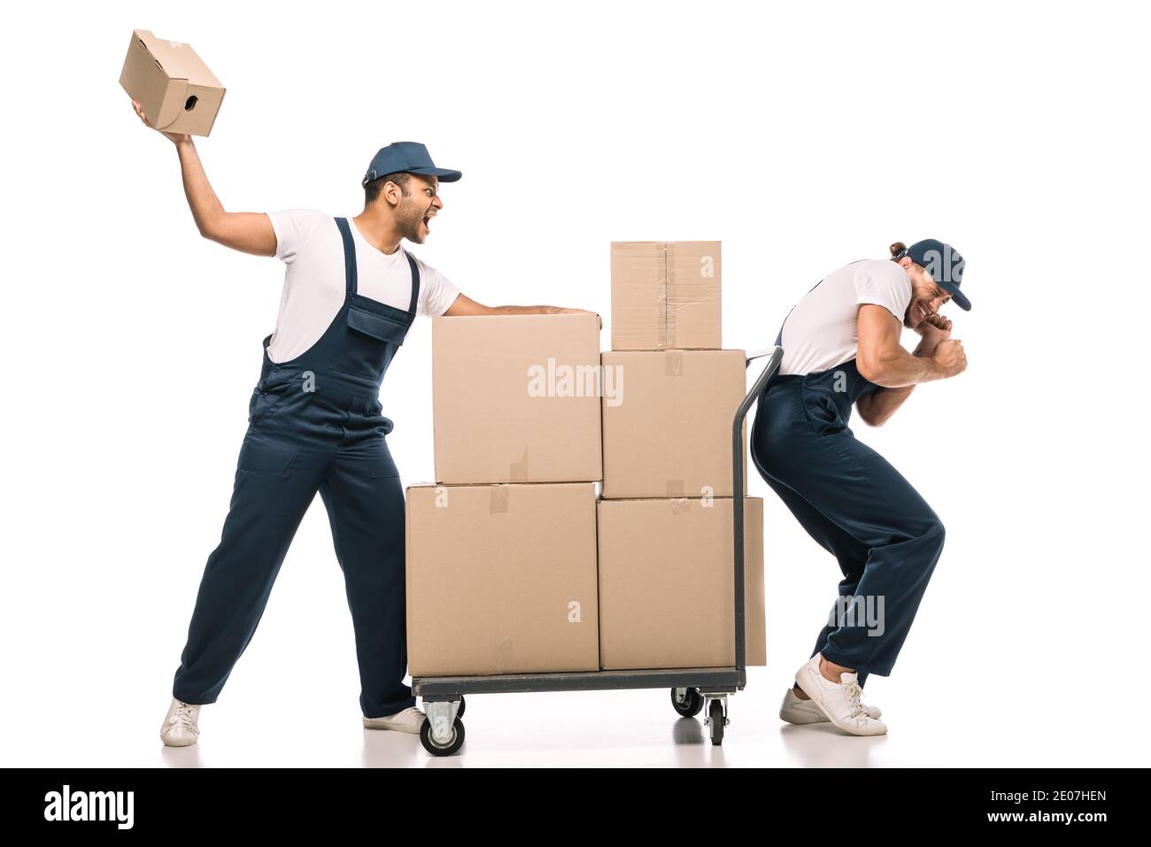 full length of angry indian mover in uniform holding carton box near ...