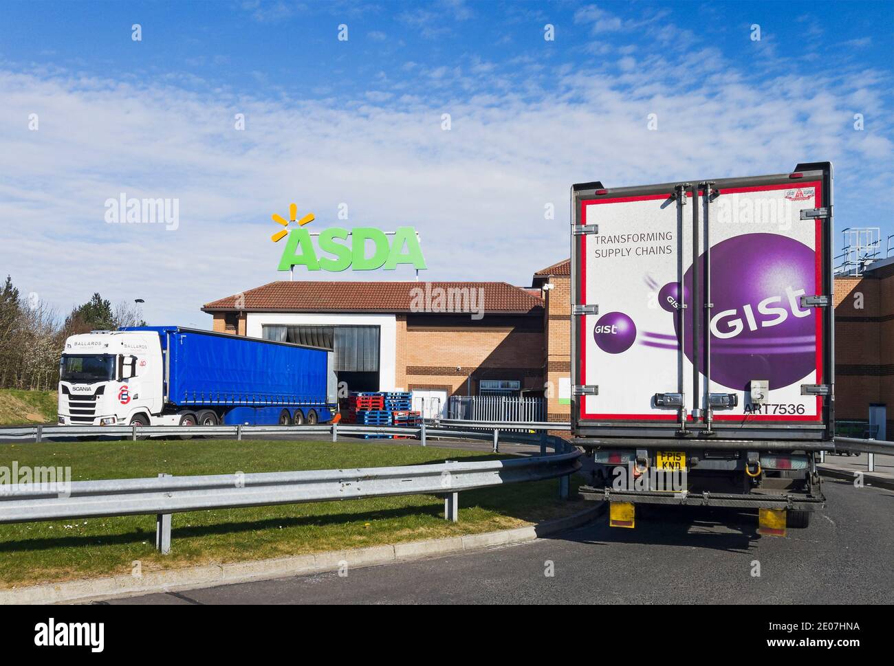 Goods wagons queue to unload at ASDA, UK Stock Photo - Alamy