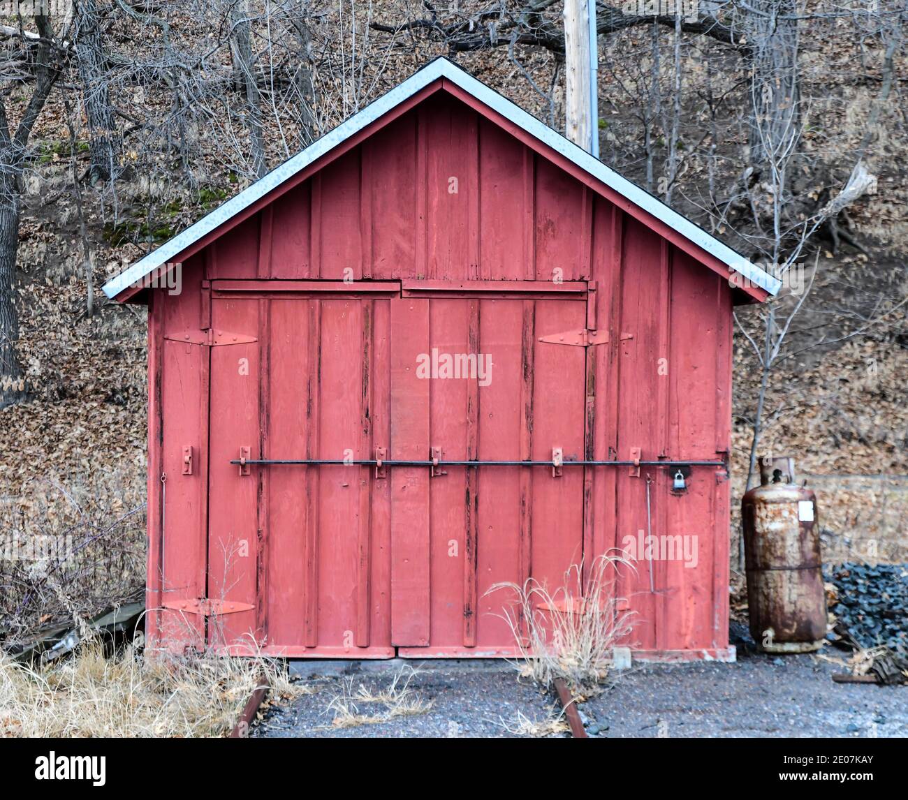 weathered wooden old farm agricultural barn in the winter farmland ...