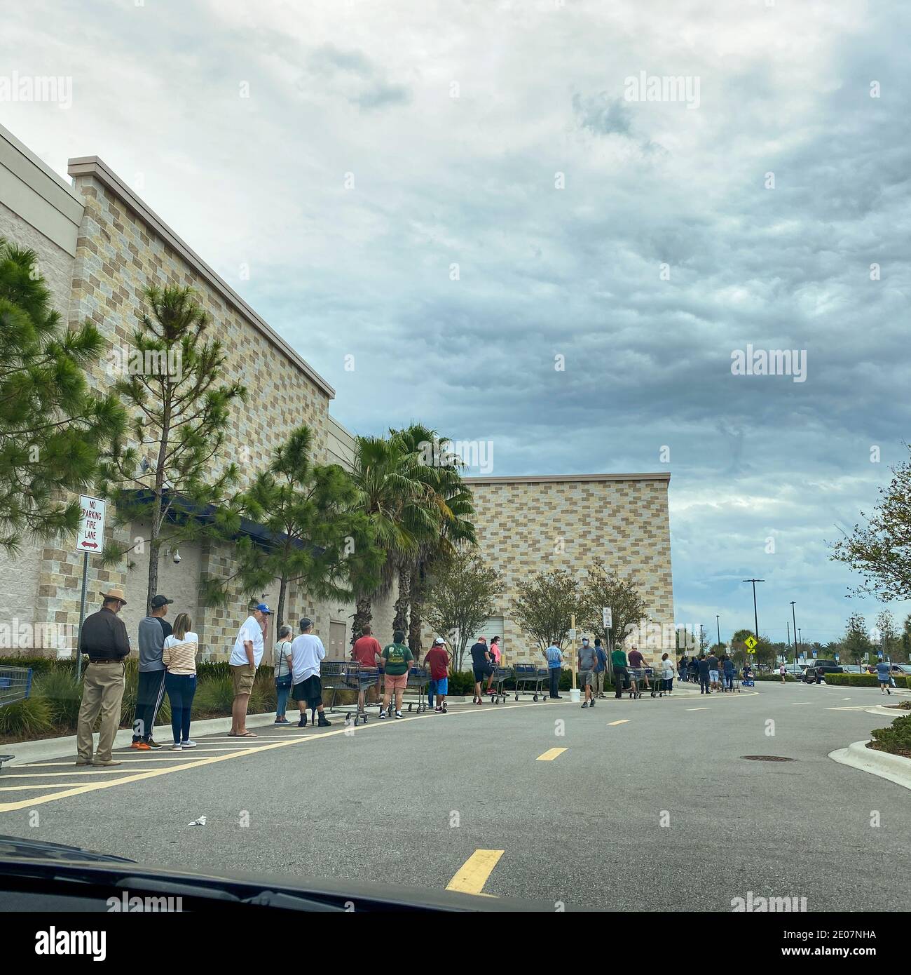 Orlando, FL USA - April 5, 2020: Customers standing in long lines ...