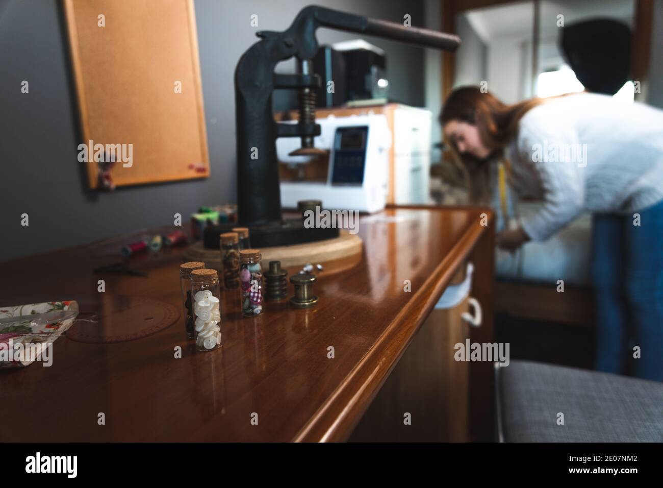 Young dressmaker sewing and manufacturing clothes Stock Photo - Alamy