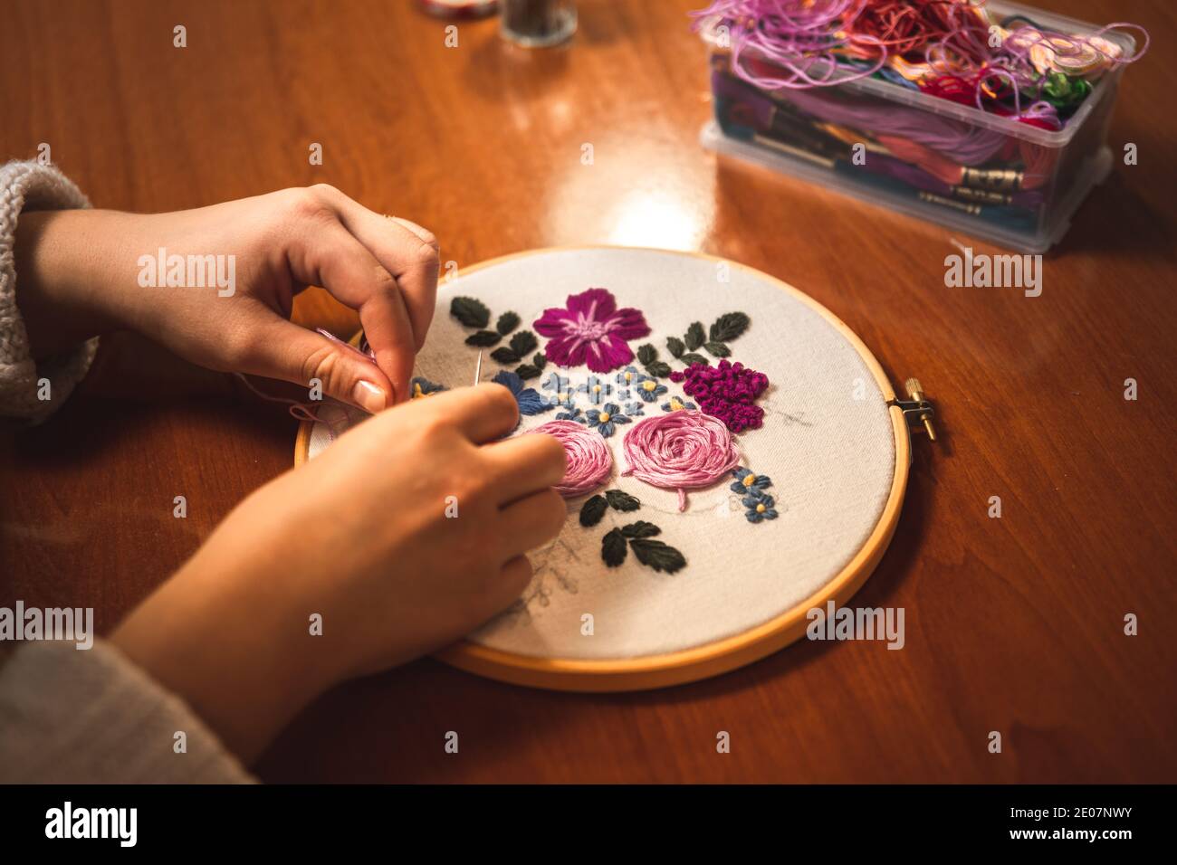 Young woman weaving a embroidery Stock Photo - Alamy