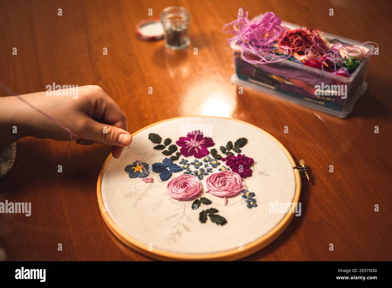 Young woman weaving a embroidery Stock Photo - Alamy