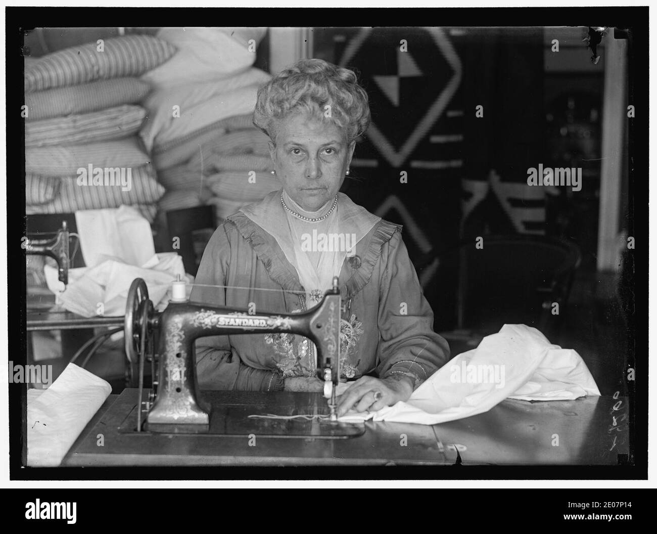 LEGION OF LOYAL WOMEN. MRS. MARY LOGAN TUCKER, SEWING ON BEDDING FOR ...