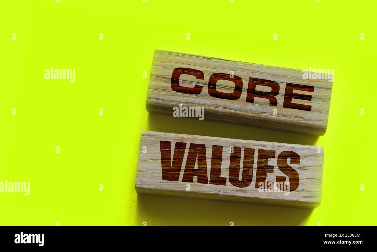 core values words on wooden blocks on yellow background. Business ...