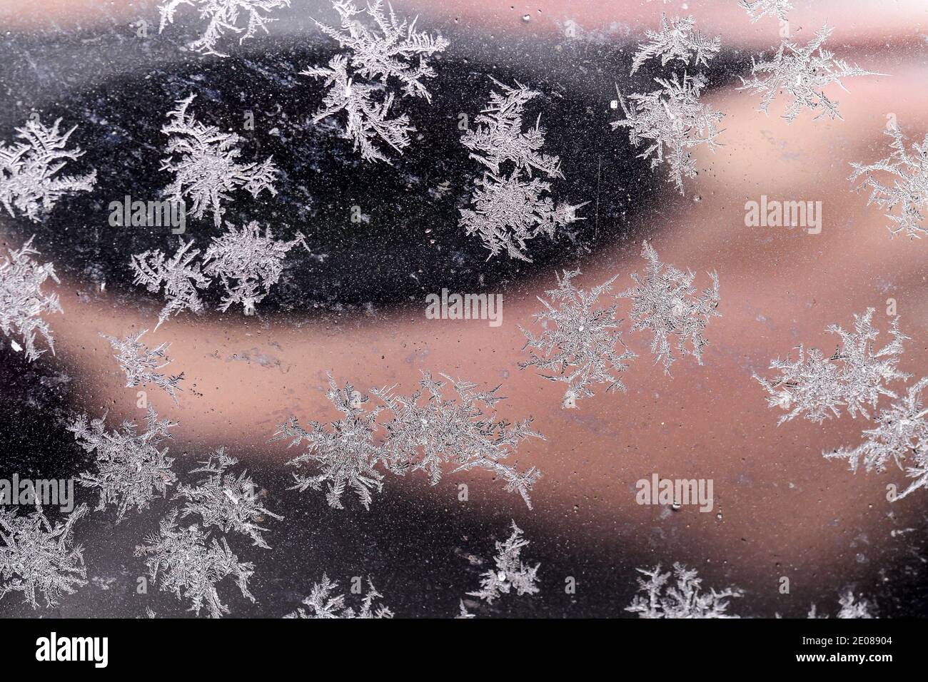 close-up of frosted ice flakes on the car window in winter Stock Photo ...