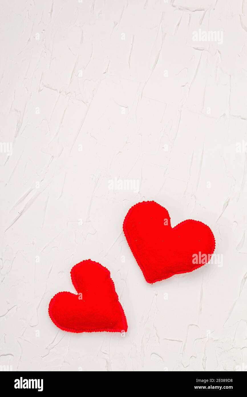 Valentine's Day concept with red hearts. Soft felt hearts and bright ...