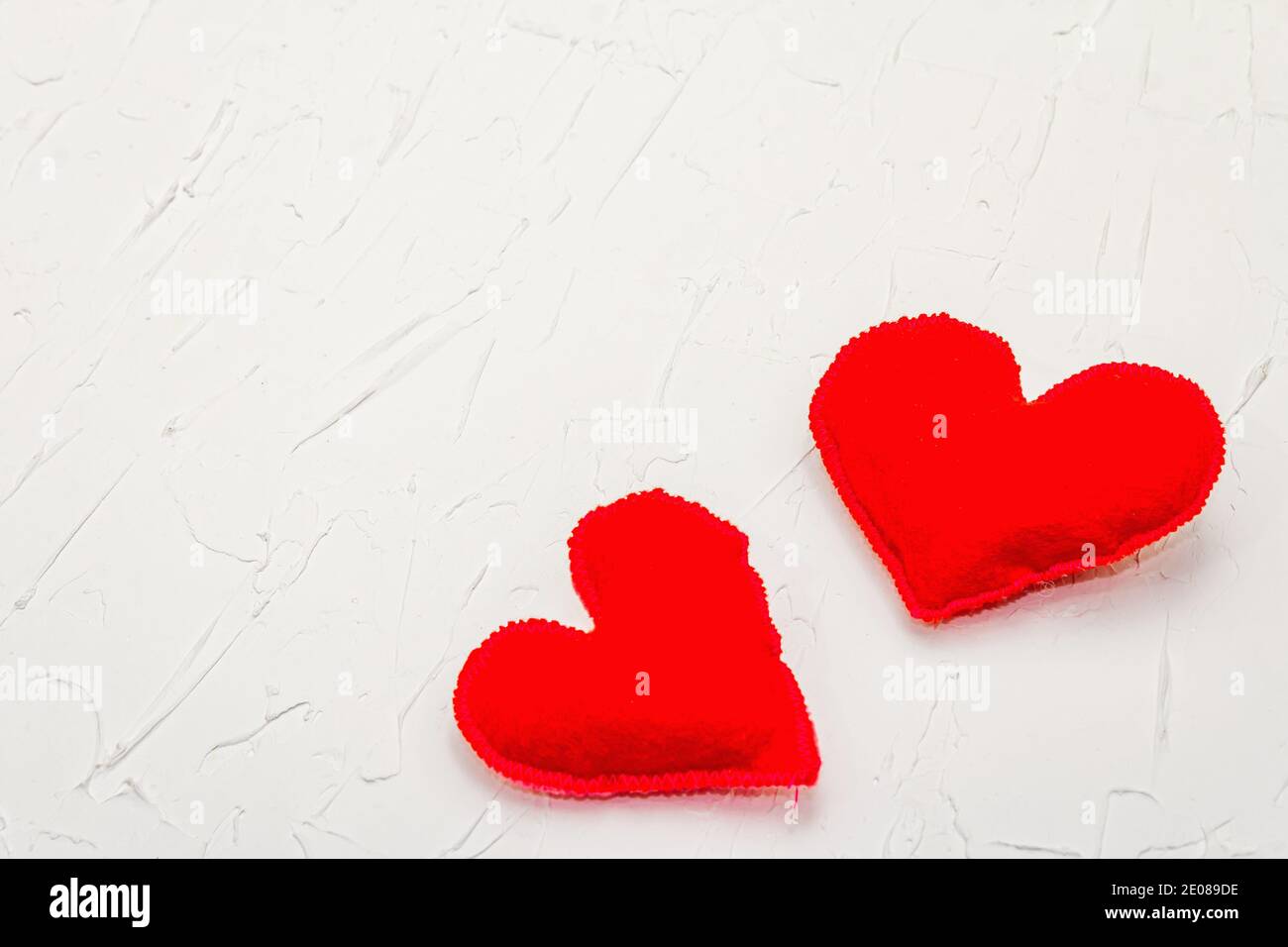 Valentine's Day concept with red hearts. Soft felt hearts and bright ...