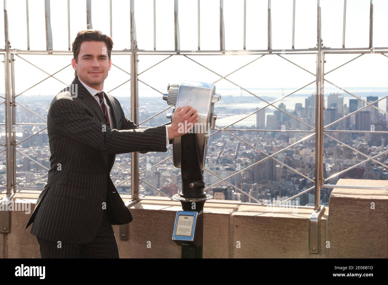 'White Collar' actor Matt Bomer poses on the top of the Empire State ...
