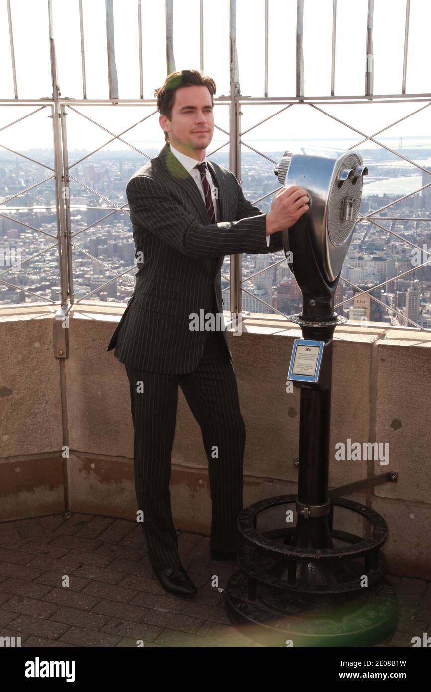 'White Collar' actor Matt Bomer poses on the top of the Empire State ...