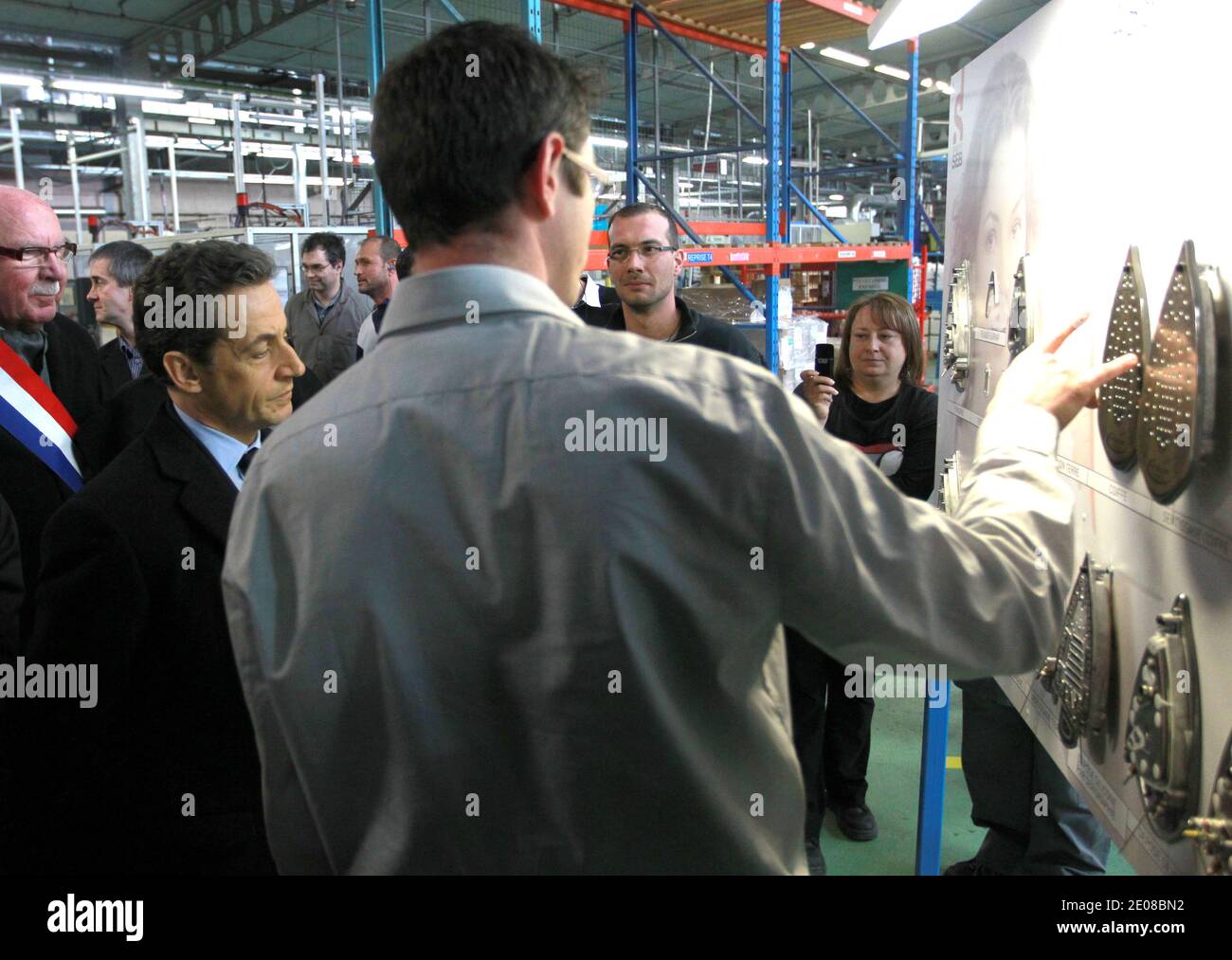 French President Nicolas Sarkozy visits the house hold appliances ...
