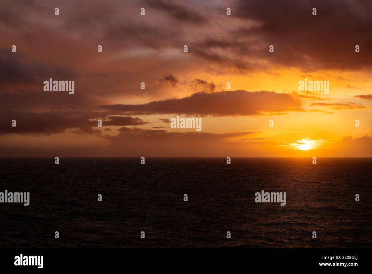 sunset over the ocean Stock Photo - Alamy