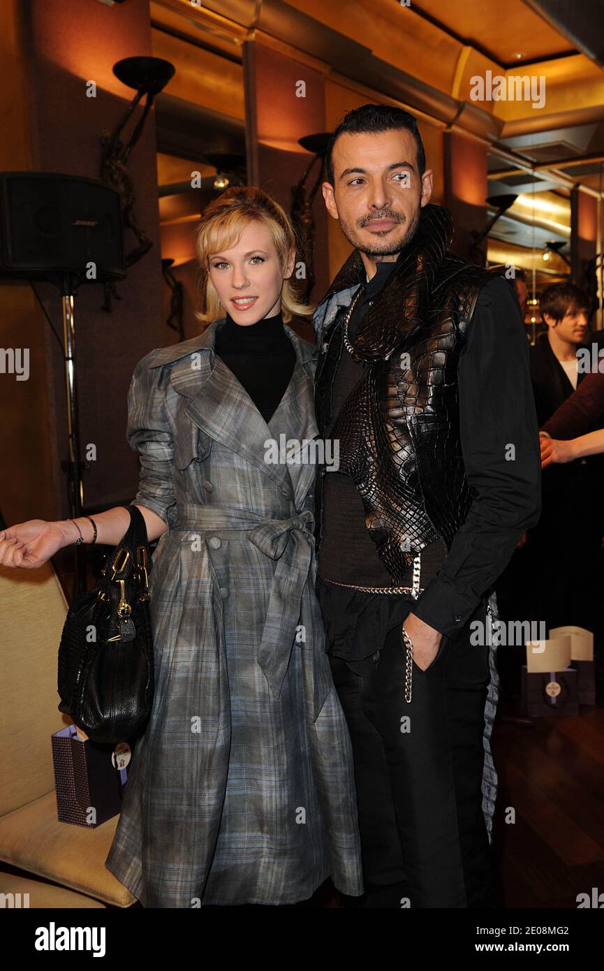 Lorie and Eric Tibusch pose for his Spring-Summer 2012 Haute Couture ...