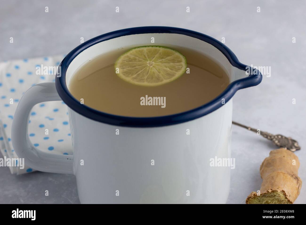 Spiced ginger drink with lemon slice garnish Stock Photo - Alamy