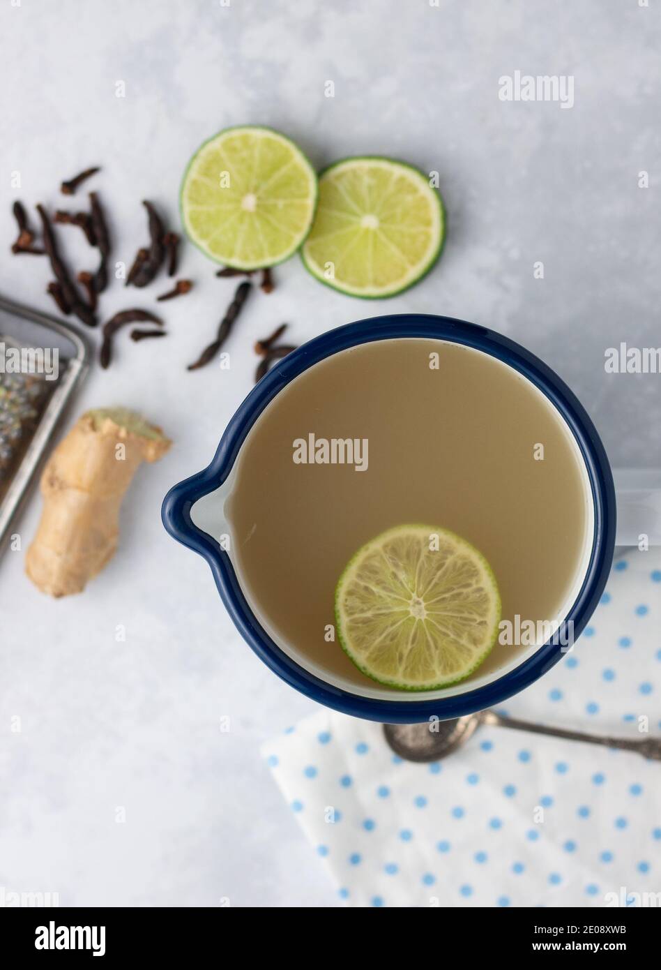 Spiced ginger drink with lemon slice garnish Stock Photo - Alamy